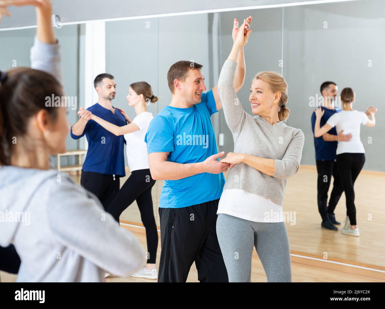 Mature dancing couple during group class Stock Photo - Alamy
