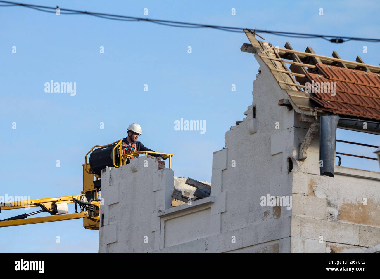 Picture of a youg male, demolition worker, working on a construction ...