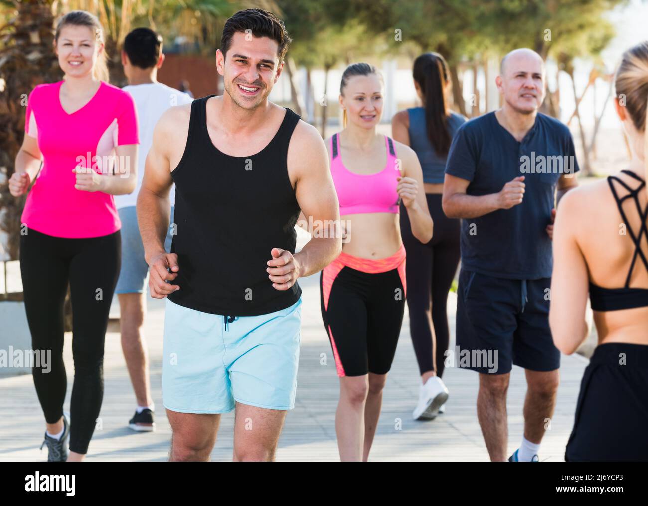 People jogging on city seafront Stock Photo - Alamy