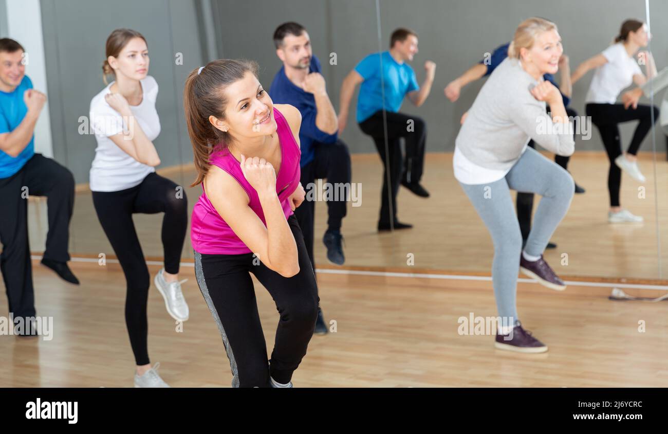 Woman training at group dance class Stock Photo - Alamy