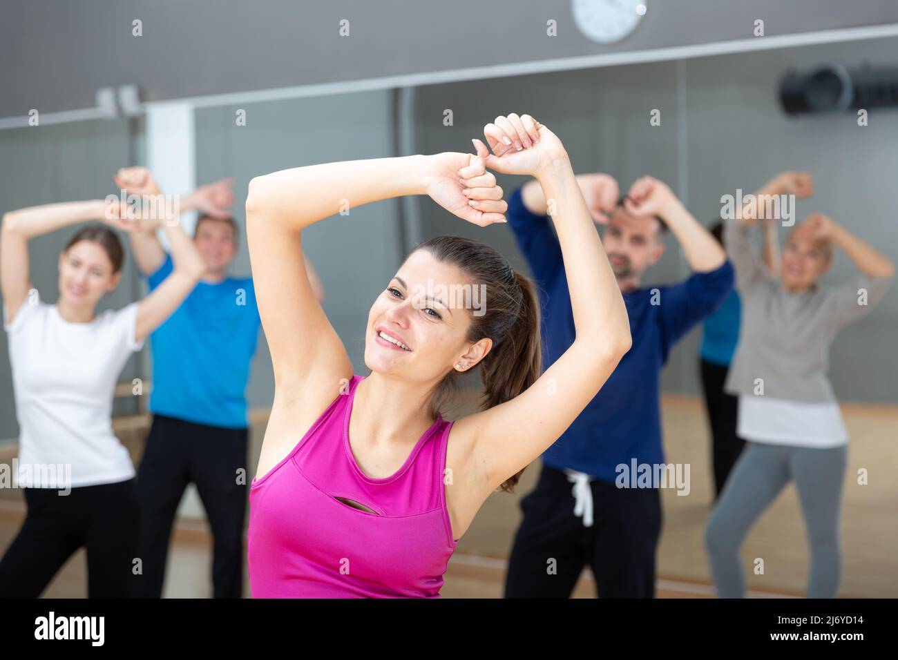 Woman training at group dance class Stock Photo - Alamy