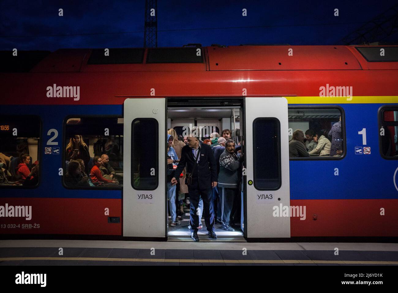 Picture of a group of people, serbs, standing, packed, in a train of ...