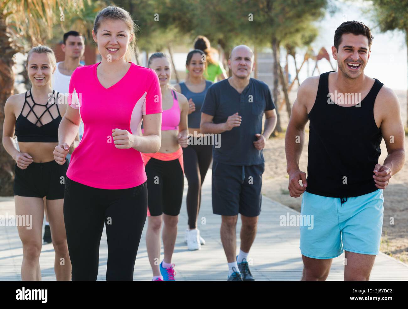 Active people during running training Stock Photo - Alamy