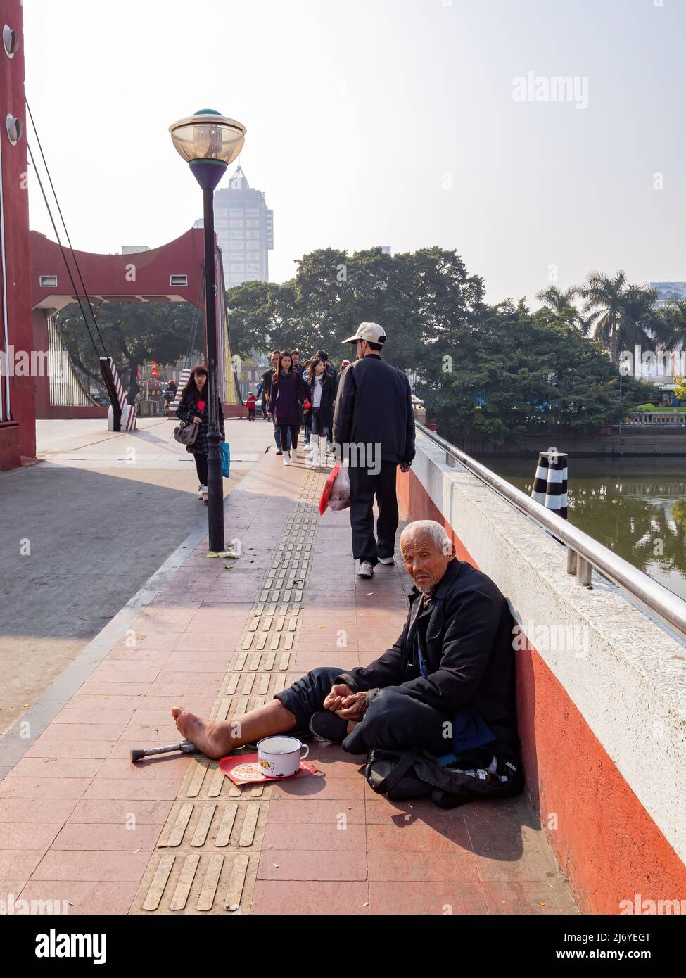 China, FEB 2 2011 - Homeless people begging on street Stock Photo - Alamy
