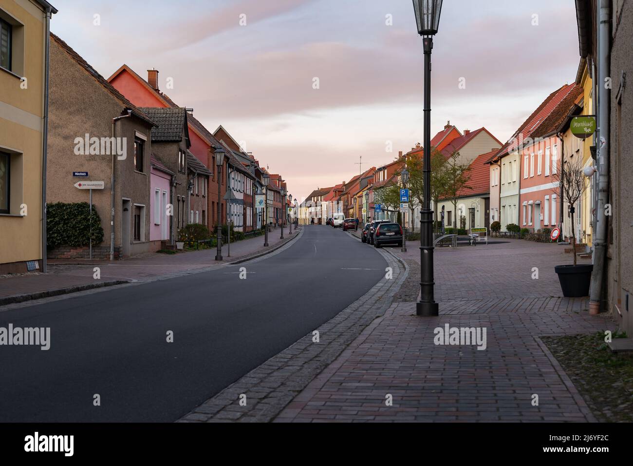 Street view in the small town. Cars parking next to the street in the ...