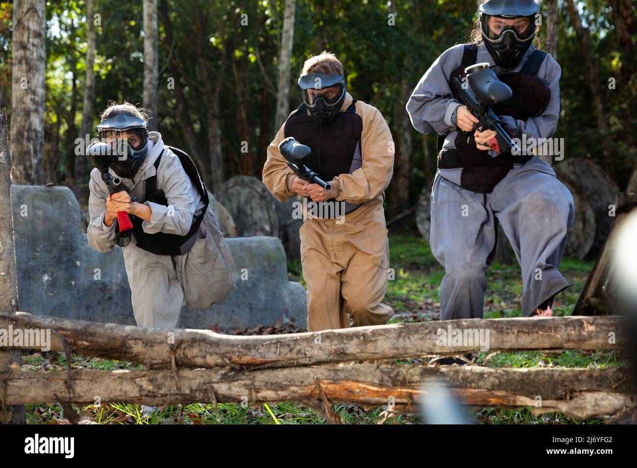 People playing paintball outdoors Stock Photo - Alamy