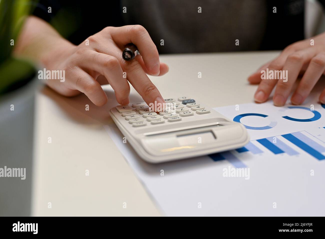 Close-up image, Female accountant working on her accounting sale report ...