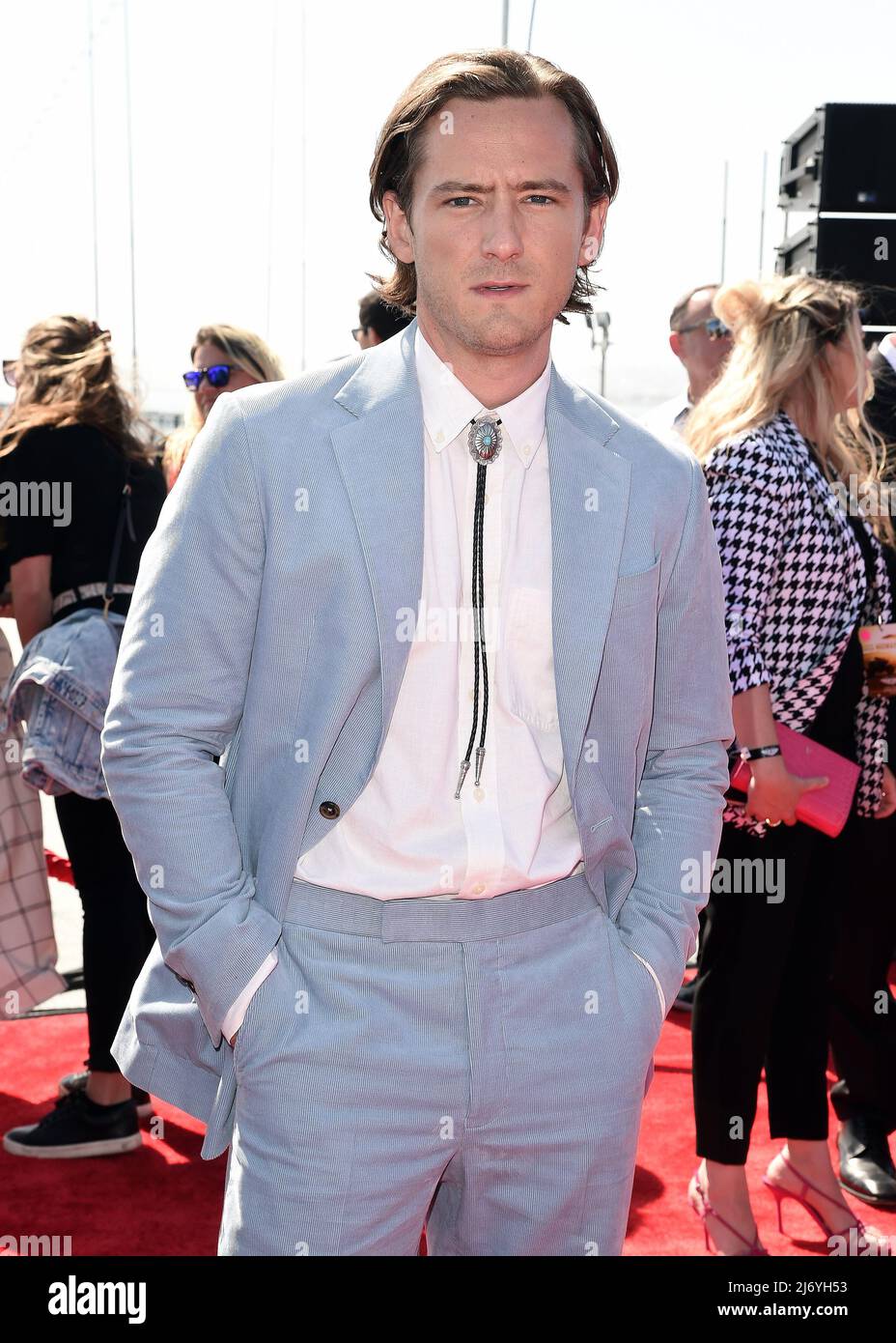 Lewis Pullman walking on the red carpet at the global premiere of "Top ...