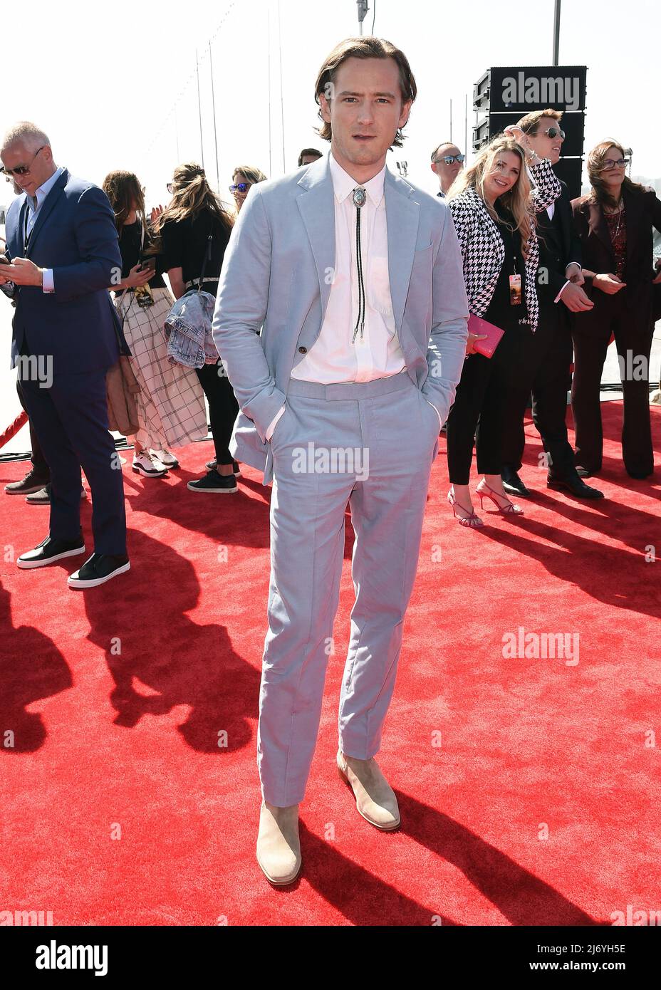 Lewis Pullman walking on the red carpet at the global premiere of "Top ...