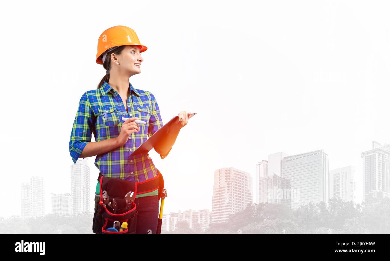 Young building inspector checking outdoor Stock Photo - Alamy