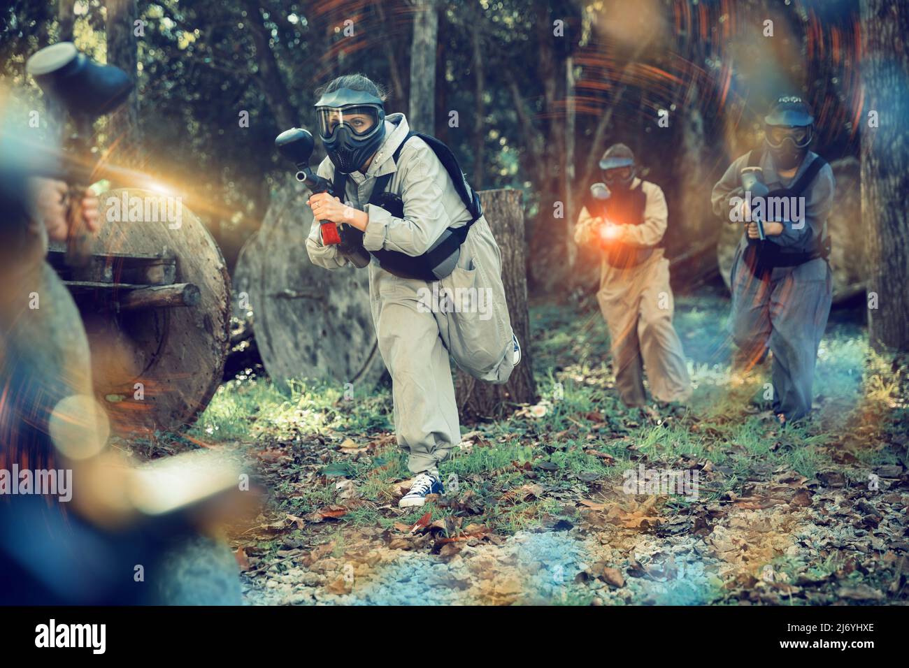 Teams playing paintball outdoors Stock Photo - Alamy