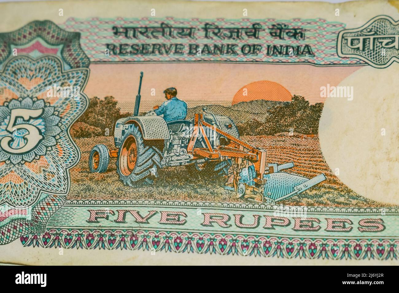 Old Five Rupee notes combined on the table, India money on the rotating ...