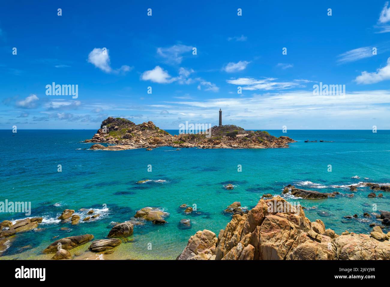 Ke Ga lighthouse is located on an island near the shore seen from above ...