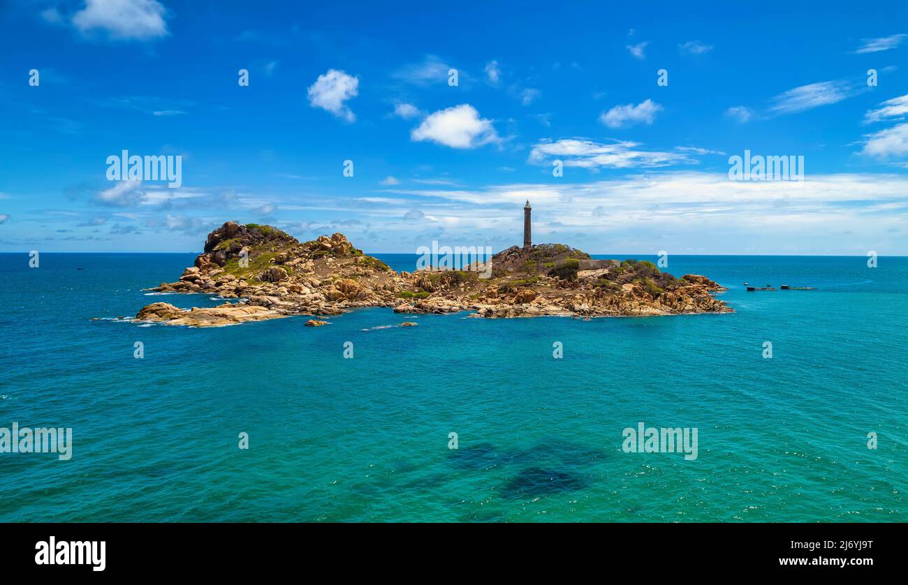 Ke Ga lighthouse is located on an island near the shore seen from above ...