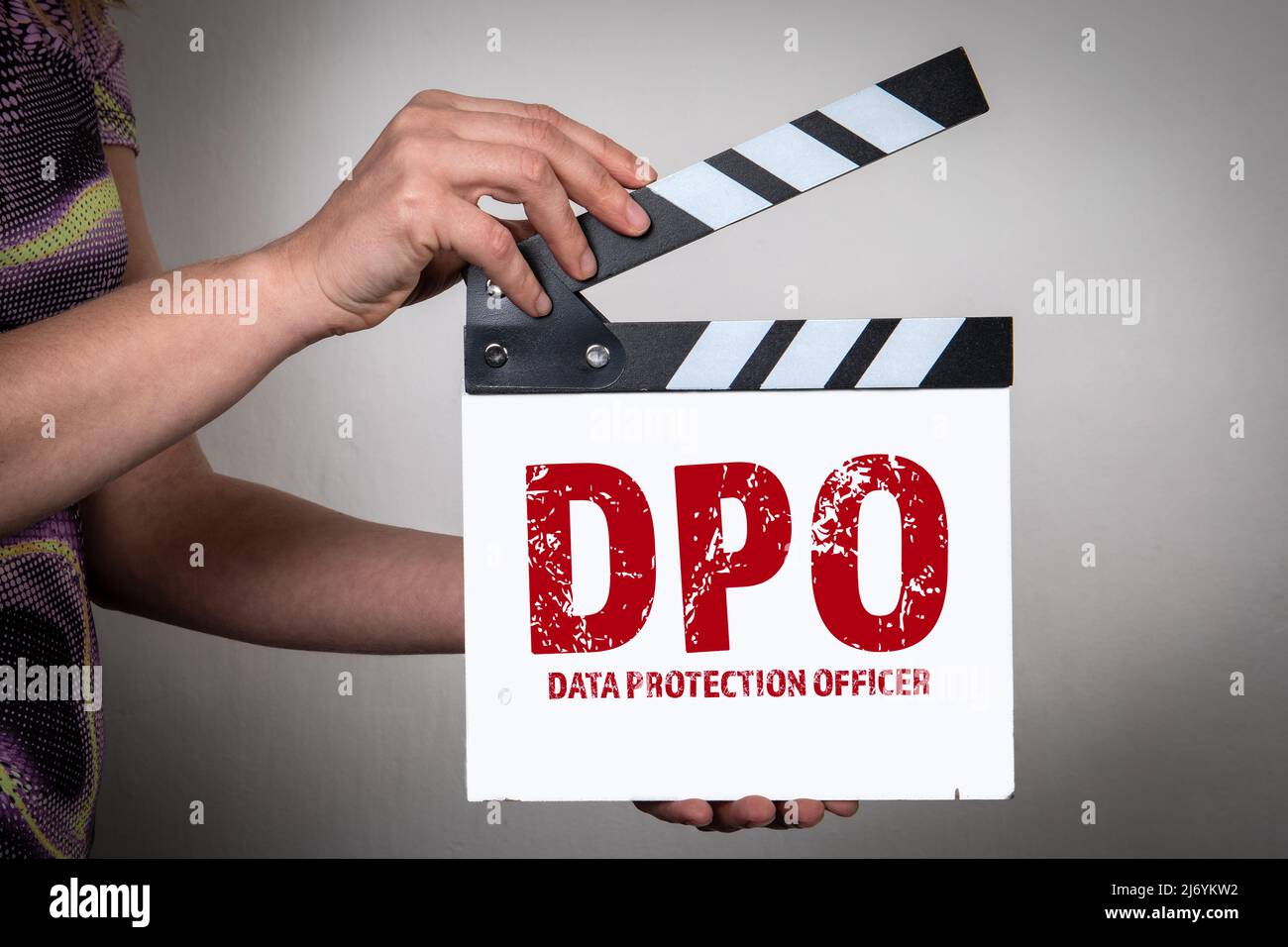 DPO Data Protection Officer Concept. Female hands holding movie clapper ...