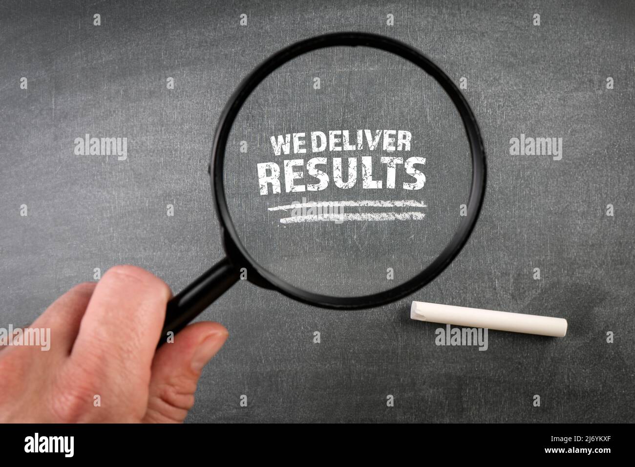 We Deliver Results. Text on a dark chalkboard background Stock Photo ...