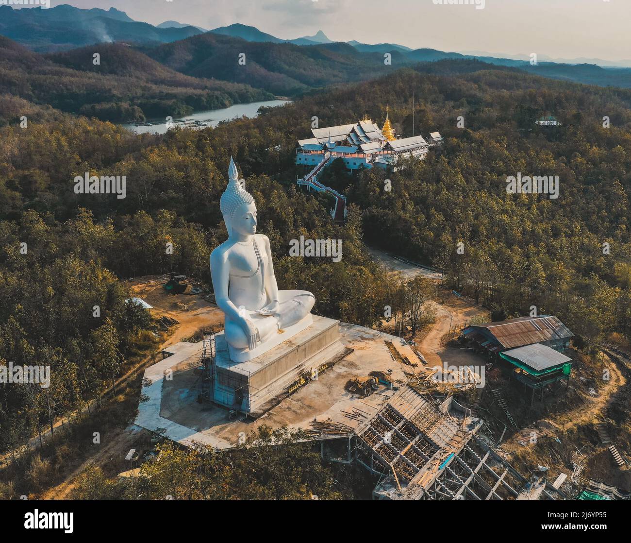 Wat Phrathat Pu Jae buddha and Huai Mae Toek lake in Phrae province ...