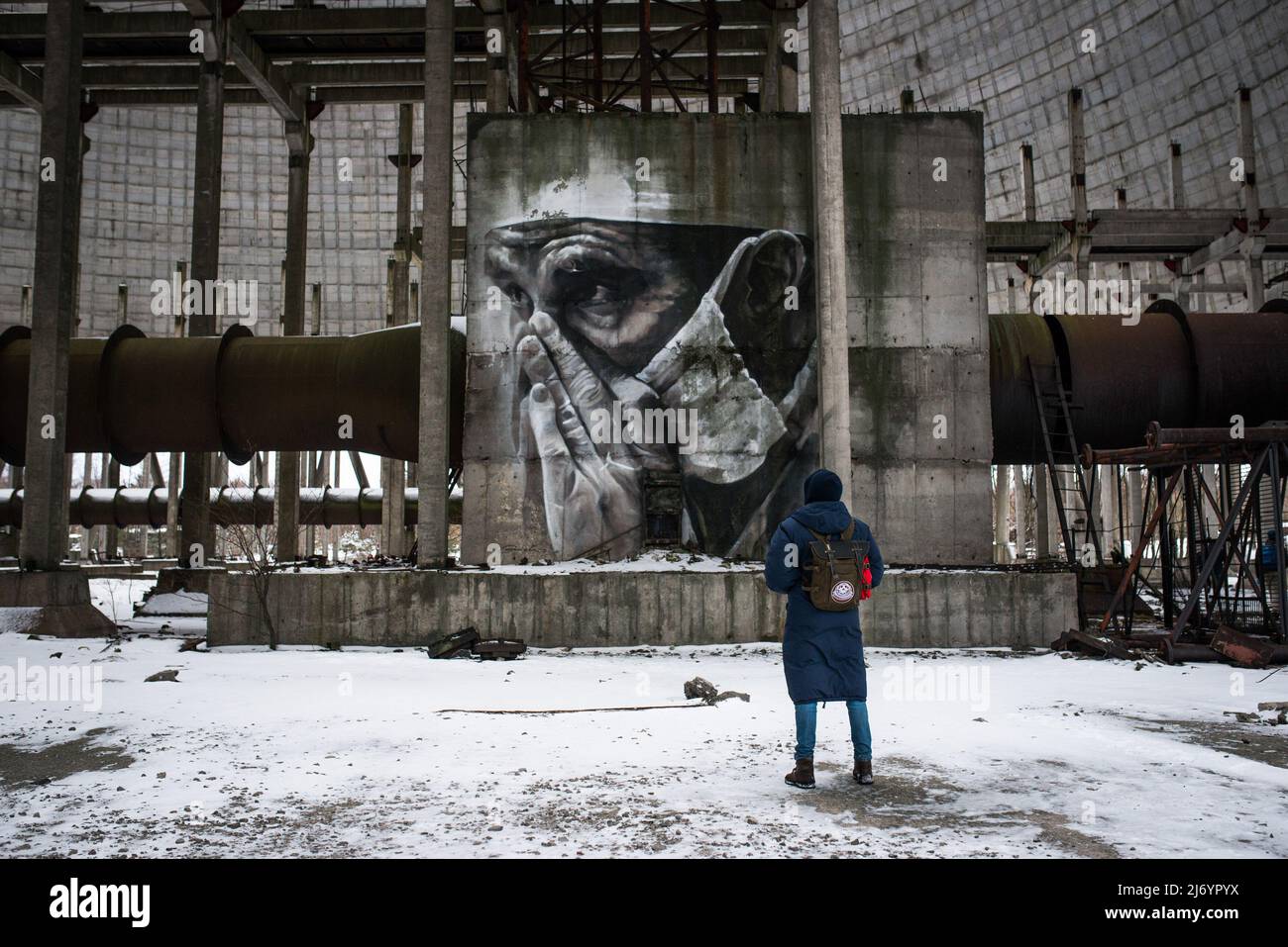 A Chernobyl guide looks at graffiti painted in memory of Chernobyl ...