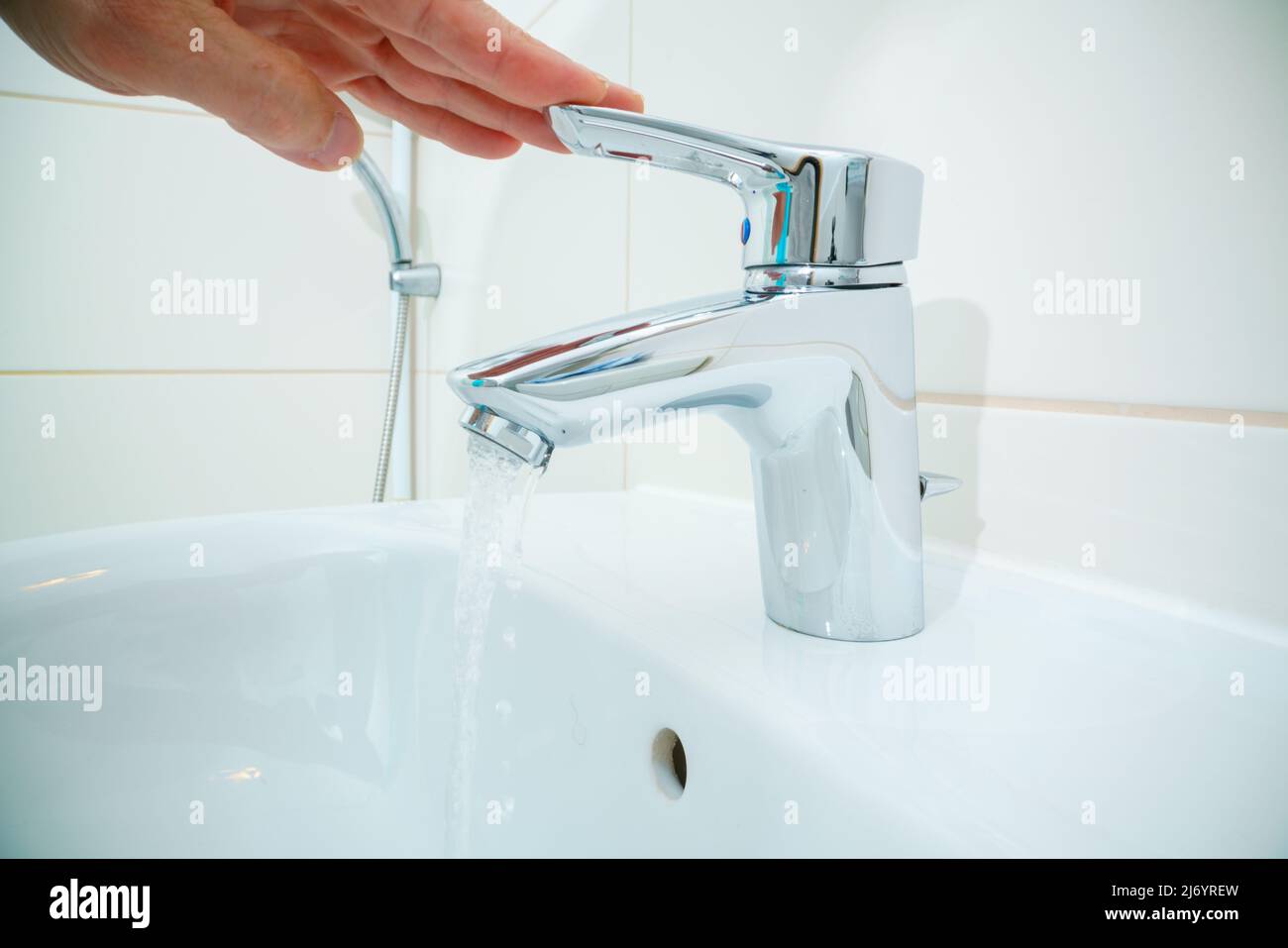 Hand closing tap water hi-res stock photography and images - Alamy