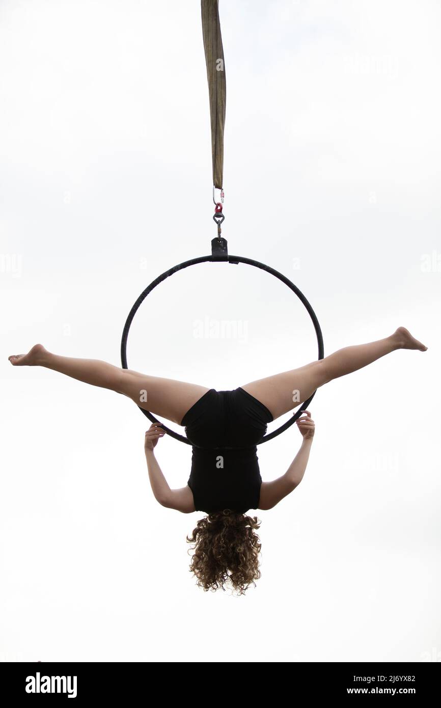 Female aerialist performing on a hoop Stock Photo - Alamy