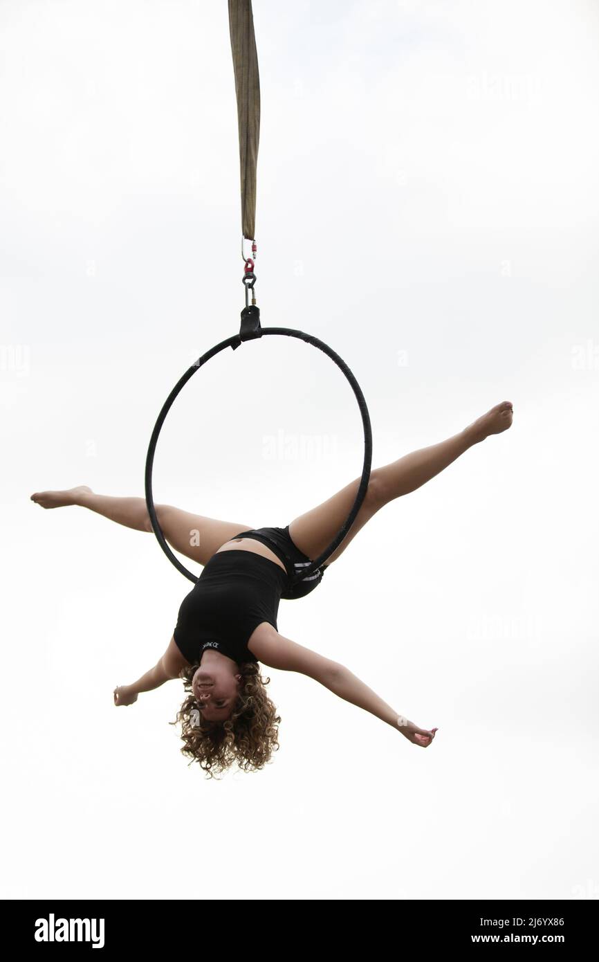 Female aerialist performing on a hoop Stock Photo - Alamy