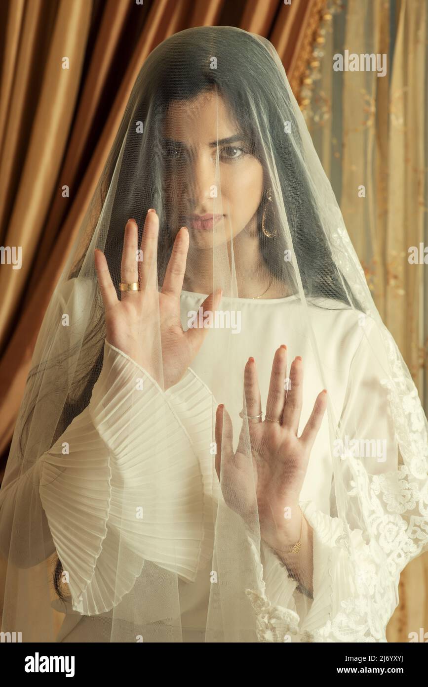 Sad woman covered with chiffon fabric Stock Photo - Alamy
