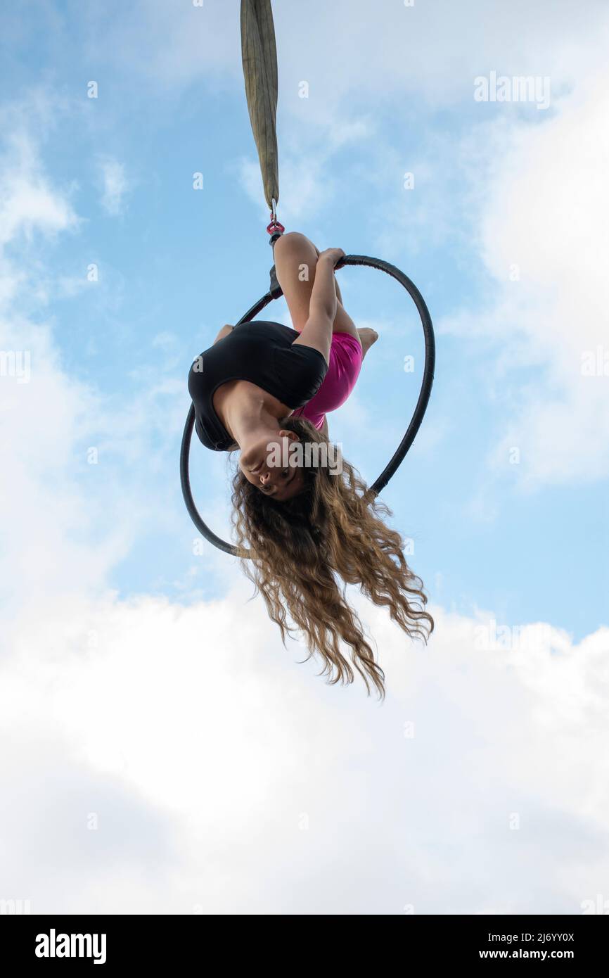 Female aerialist performing on a hoop Stock Photo - Alamy