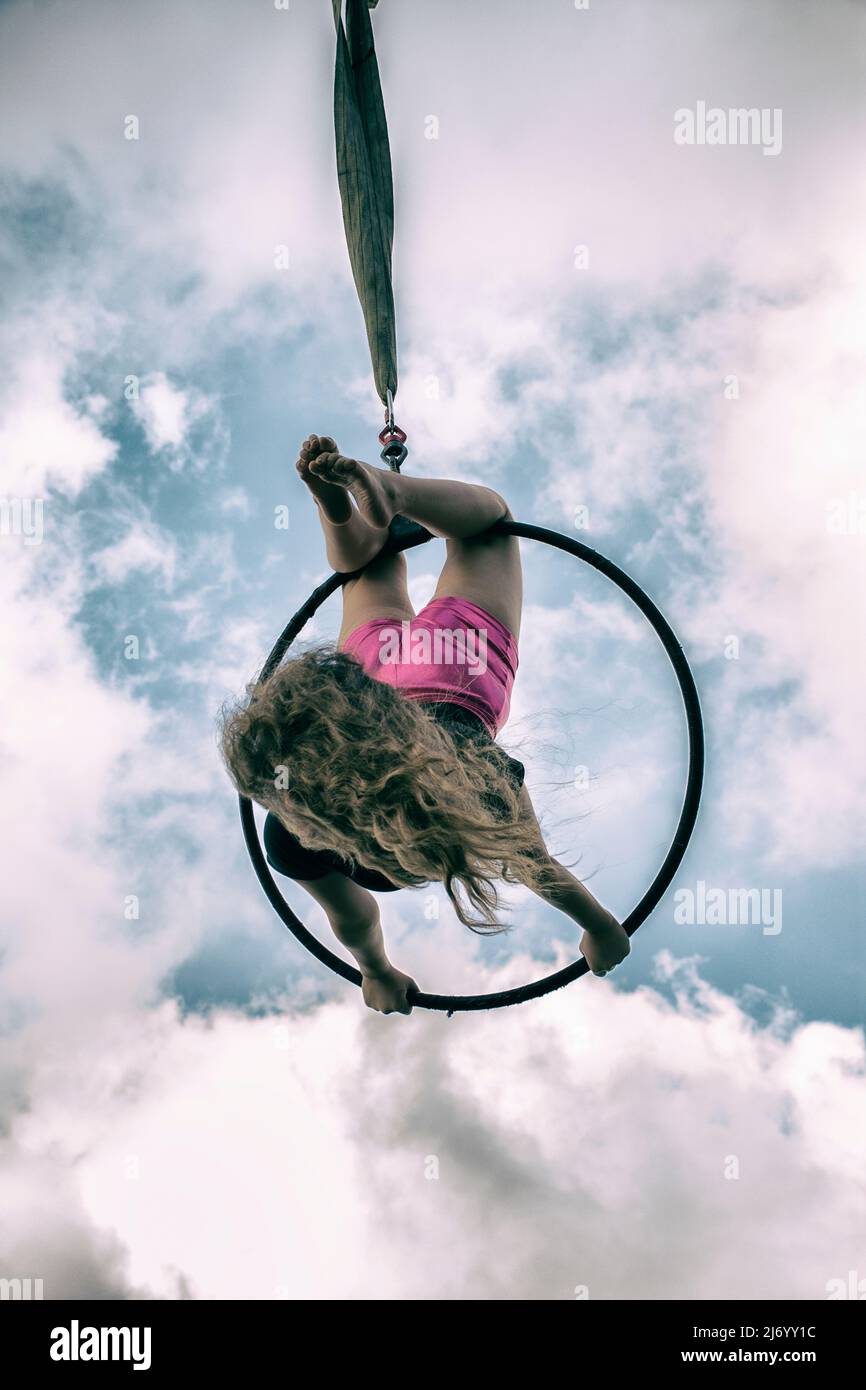 Female aerialist performing on a hoop Stock Photo - Alamy