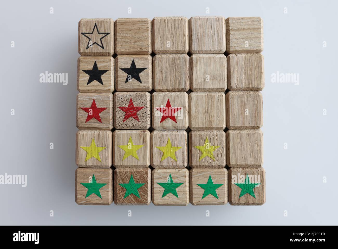 Wooden cubes reviews stars and feedback closeup Stock Photo - Alamy
