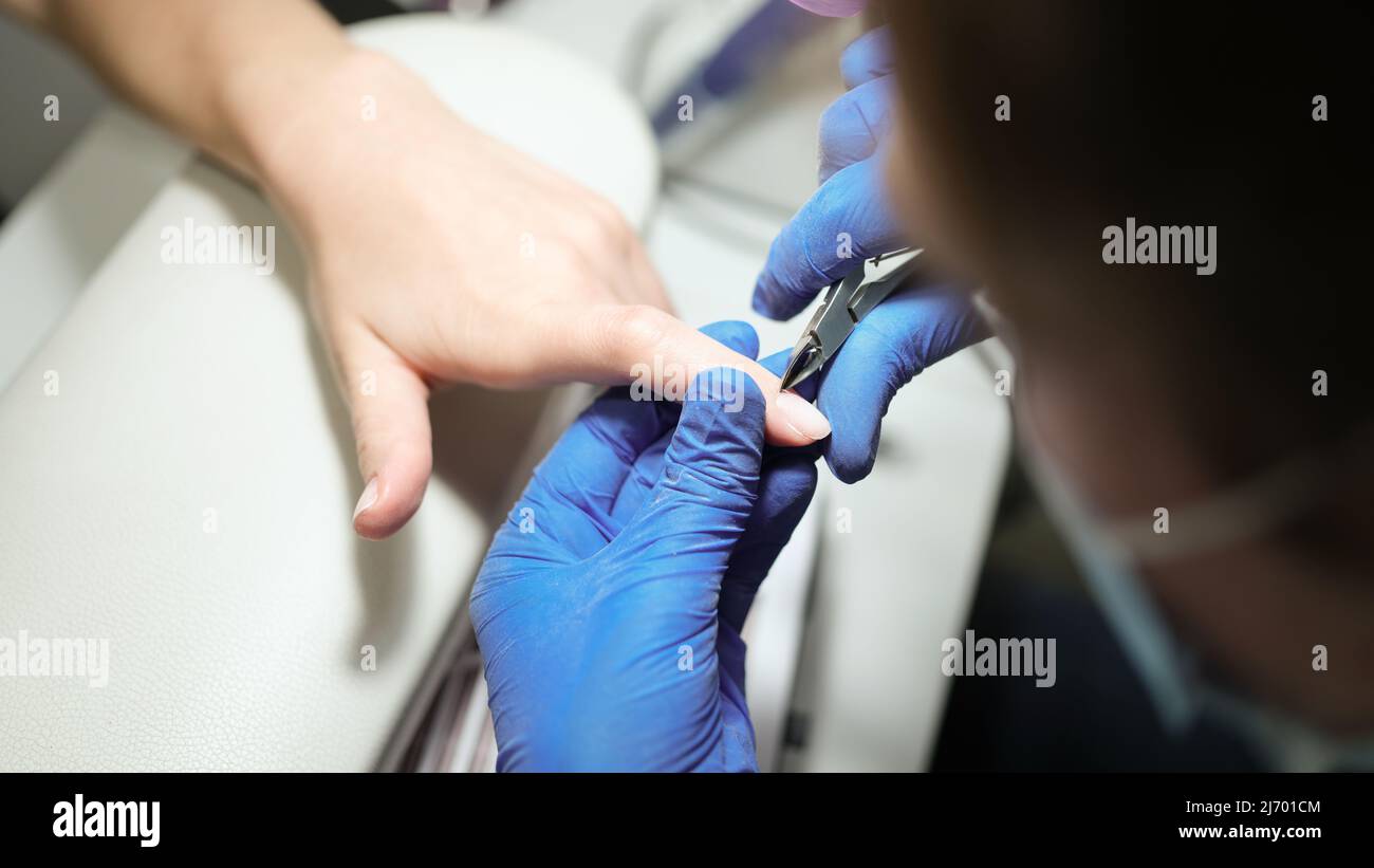 Woman doing manicure in nail hi-res stock photography and images - Alamy
