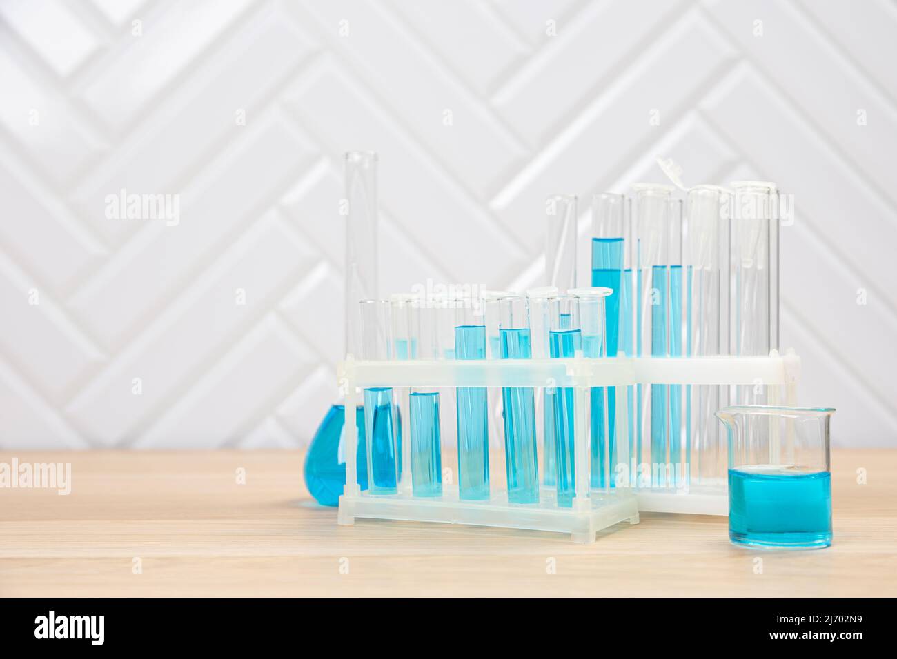 Laboratory glassware with test tubes. flasks, dropper, petri dishes ...