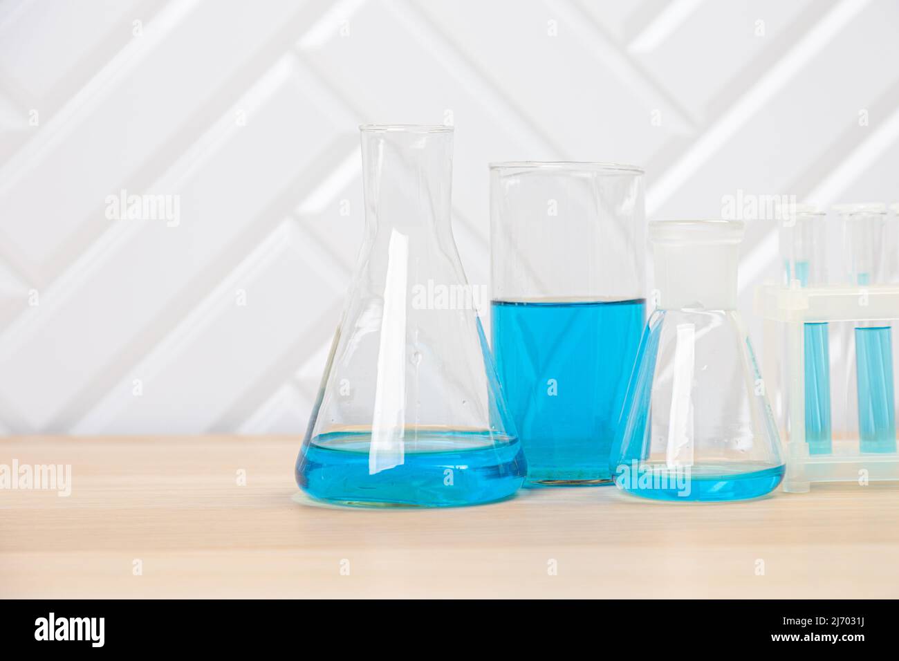 Laboratory glassware with test tubes. flasks, dropper, petri dishes ...