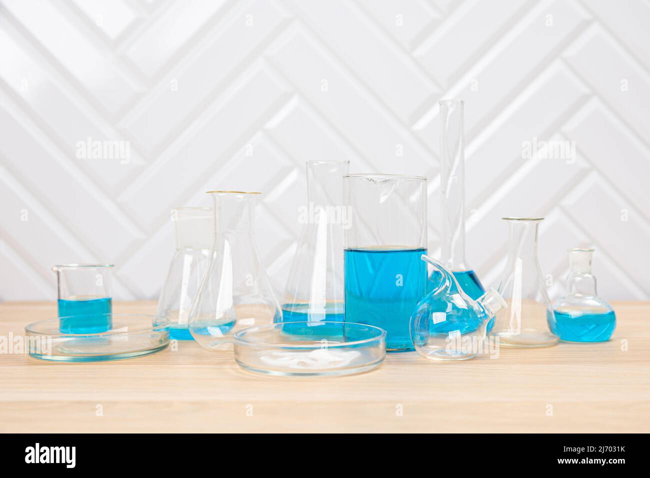 Laboratory glassware with test tubes. flasks, dropper, petri dishes ...