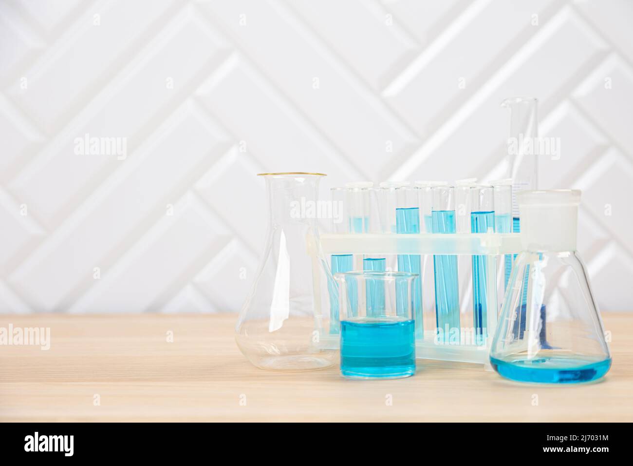 Laboratory glassware with test tubes. flasks, dropper, petri dishes ...