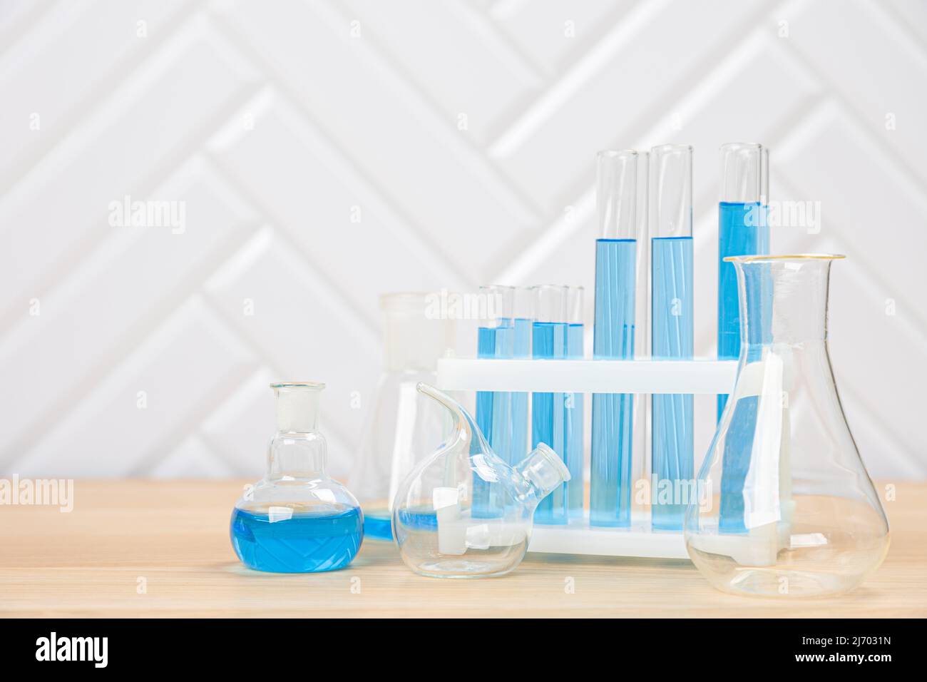 Laboratory glassware with test tubes. flasks, dropper, petri dishes ...