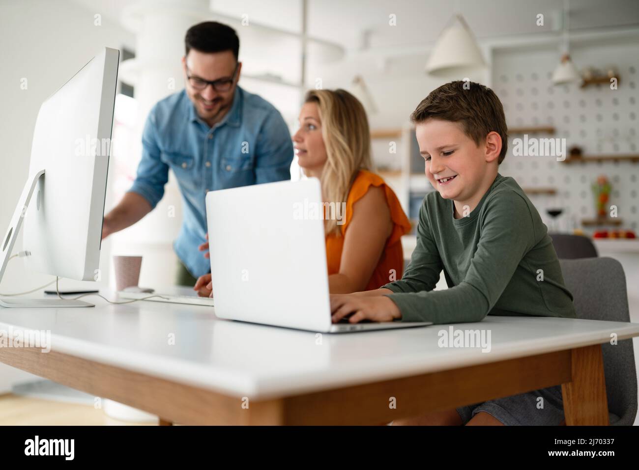 Working from home with child. Busy business parents working while kid ...