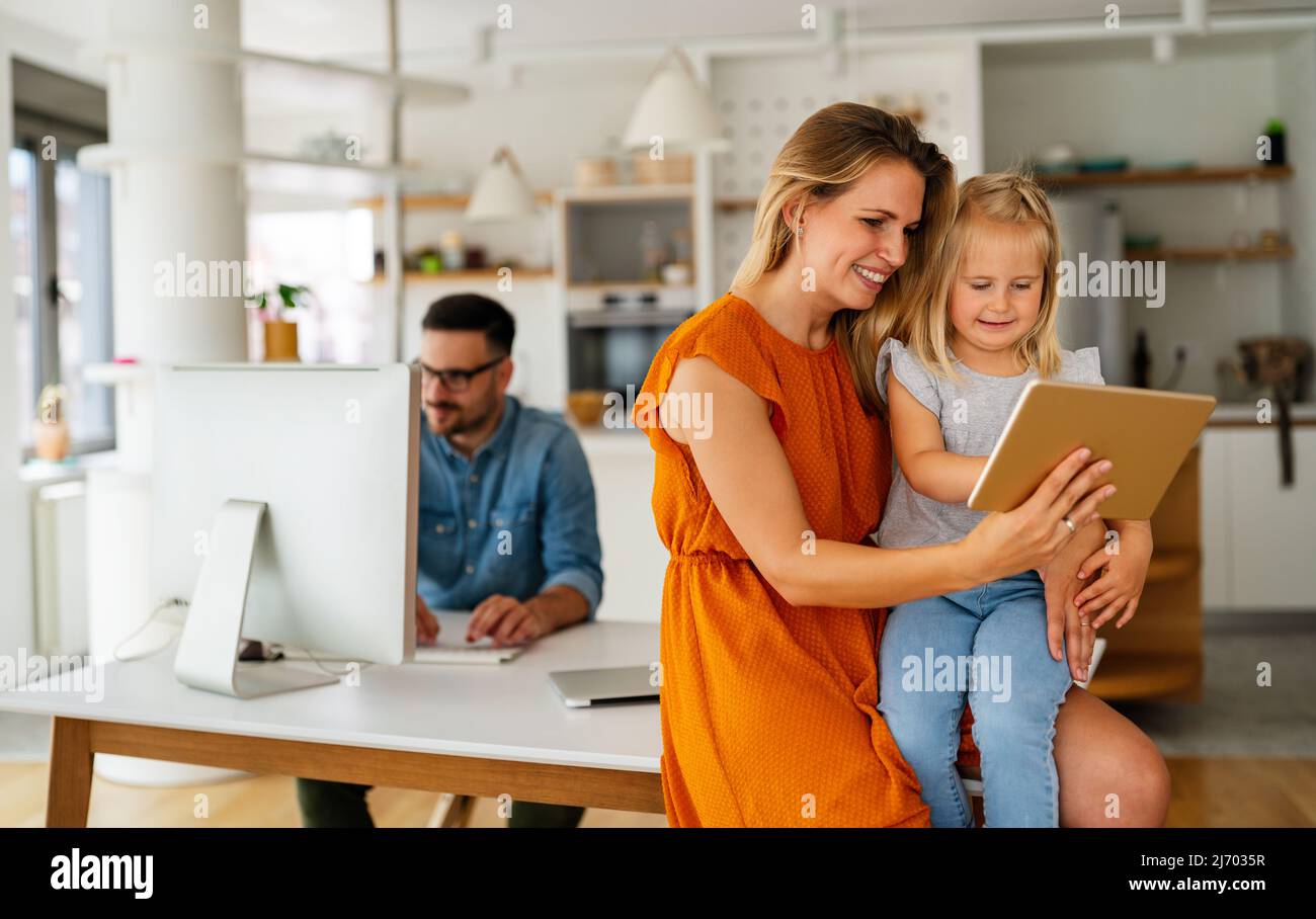 Device technology family online education concept. Happy family with ...