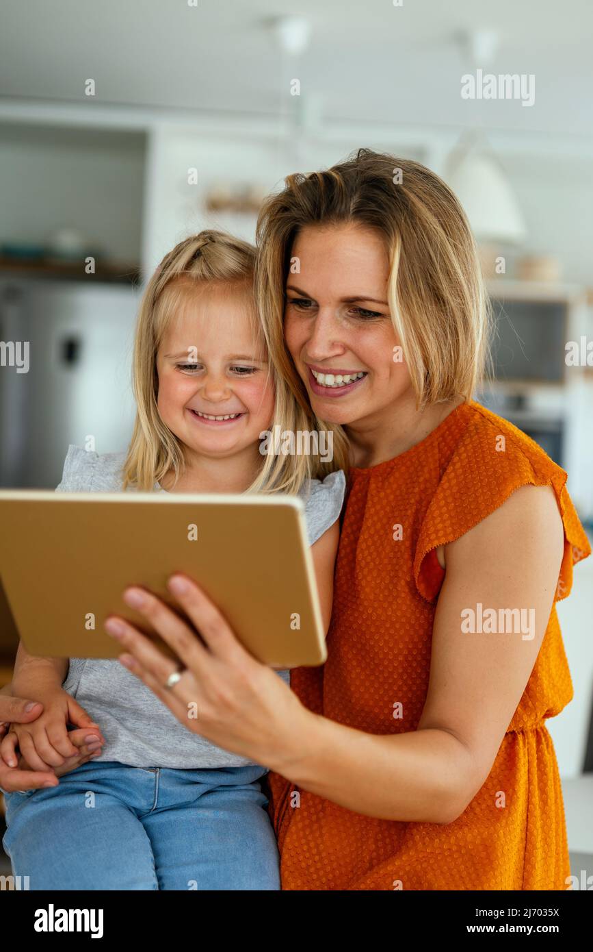 Device technology family online education concept. Happy family with ...