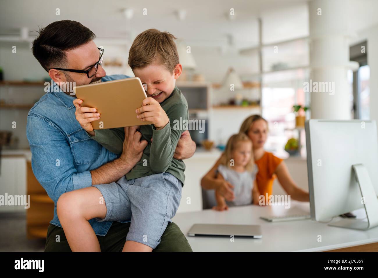 Device technology family online education concept. Happy family with ...