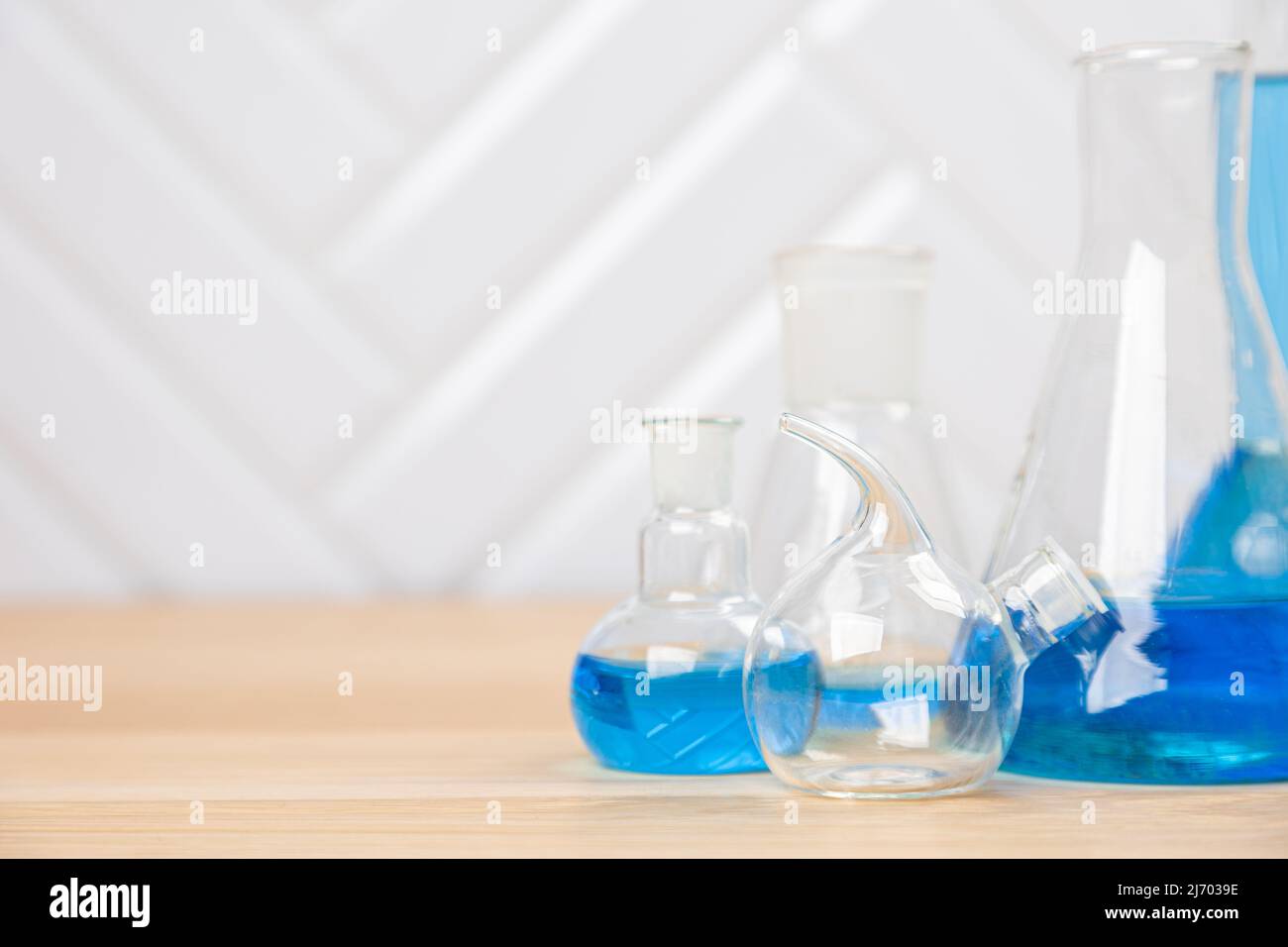 Laboratory glassware with test tubes. flasks, dropper, petri dishes ...