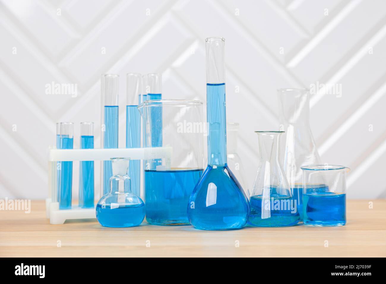 Laboratory glassware with test tubes. flasks, dropper, petri dishes ...