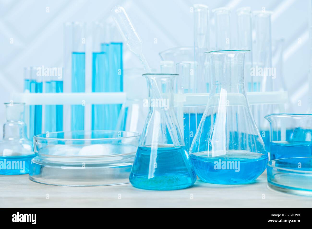 Laboratory glassware with test tubes. flasks, dropper, petri dishes ...
