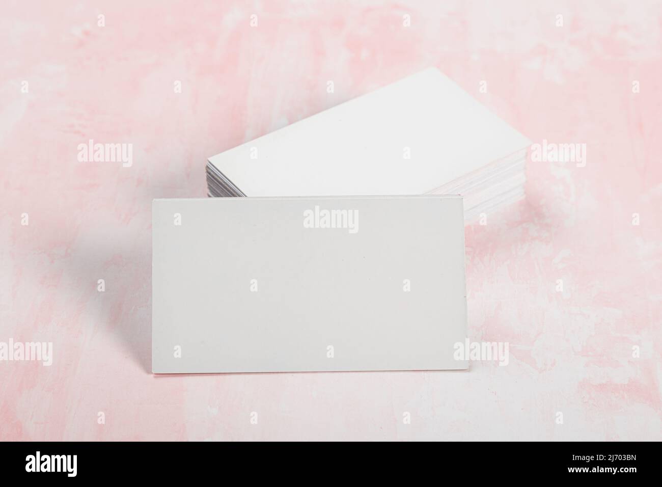 Photos of business cards. Mock-up for corporate identity on a pink ...