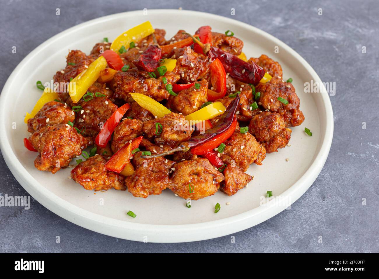 Asian Stir-Fried Chicken With Bell Peppers on a Plate Top Down Photo ...