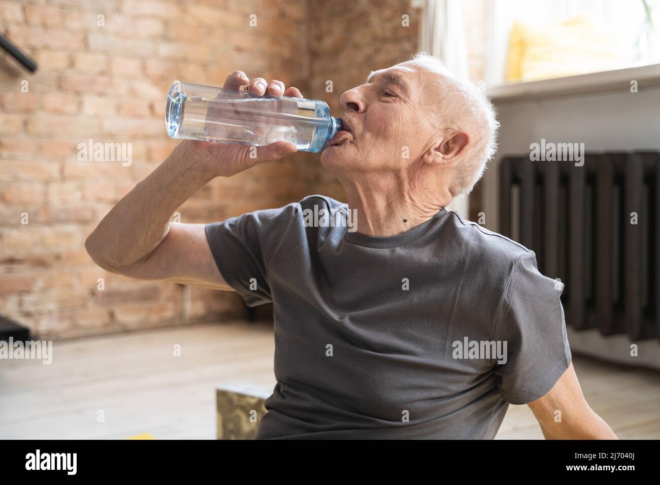 Old man drinking water care home hi-res stock photography and images ...