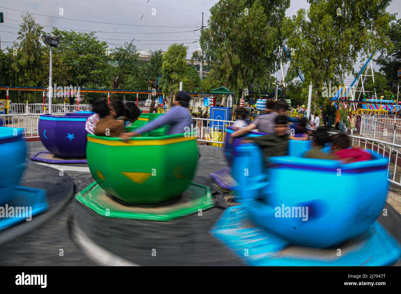 Pakistani kids enjoy their time at an amusement park during the second ...
