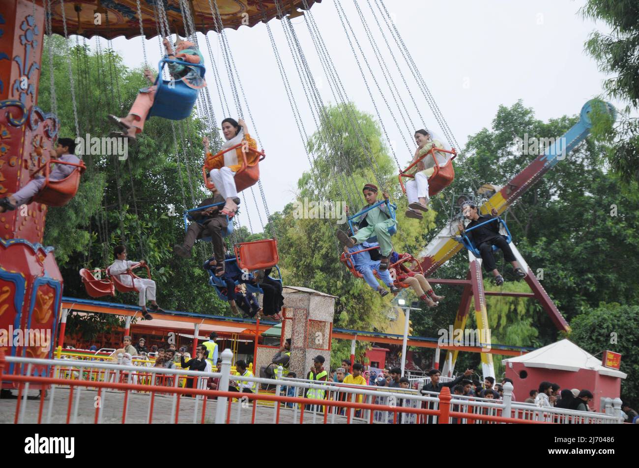 Pakistani kids enjoy their time at an amusement park during the second ...