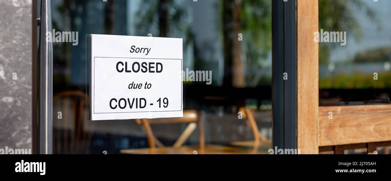 The sign in front of the office is temporarily closed Stock Photo - Alamy