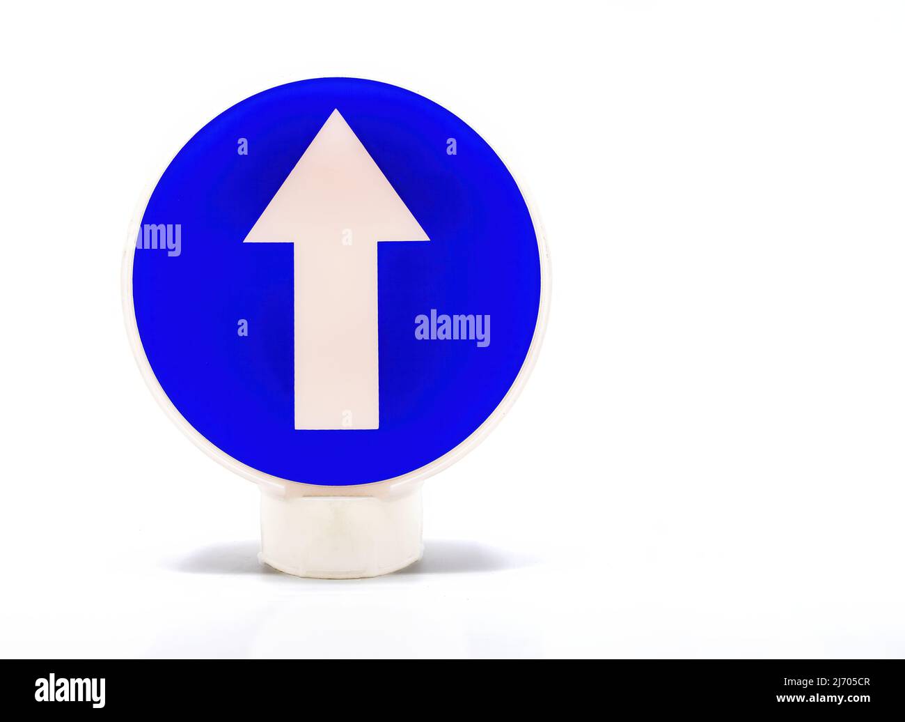 Traffic sign with a white arrow on a blue background indicating a ...