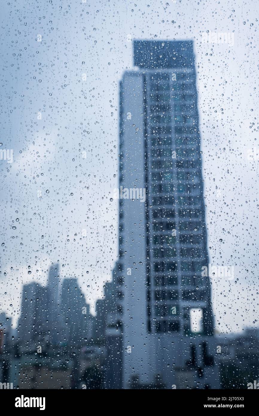 Abstract image of Rain drops on the dirty glass windows with modern ...
